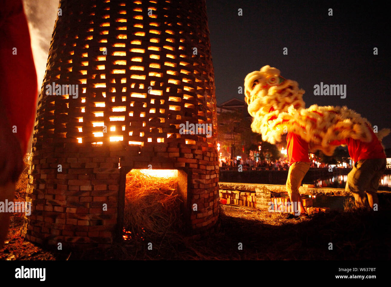 A pagoda made of tile bricks is on fire to mark the Mid-Autumn Festival ...