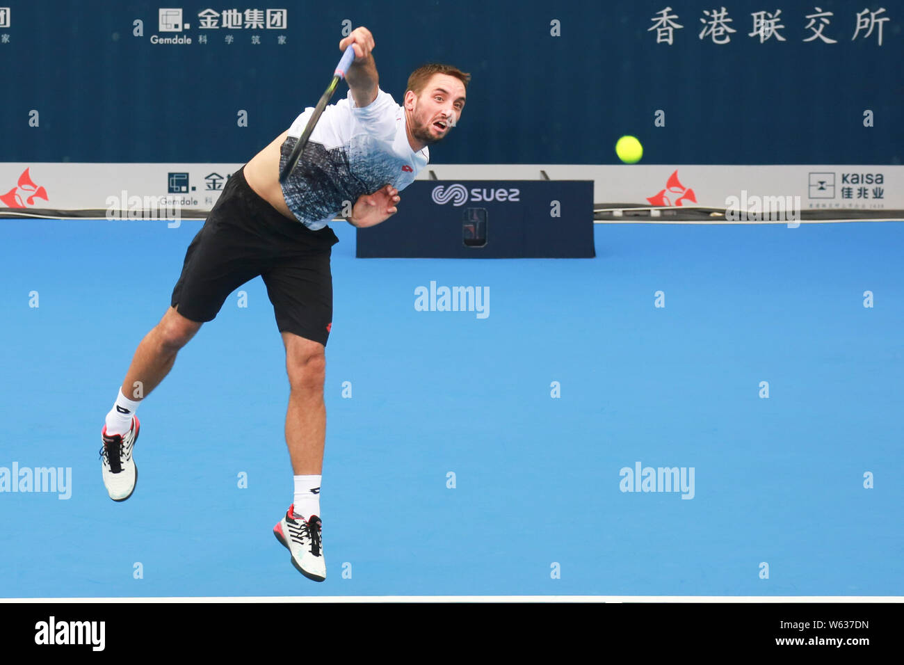 Viktor Troicki of Serbia serves against Albert Ramos Vinolas of Spain ...