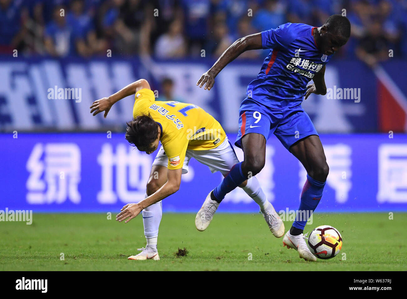 Senegalese football player Demba Ba, right, of Shanghai Greenland ...