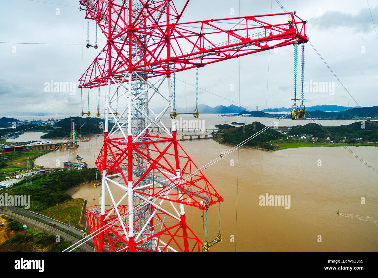 Chinese workers check on the Zhoushan 500 KV networking power ...