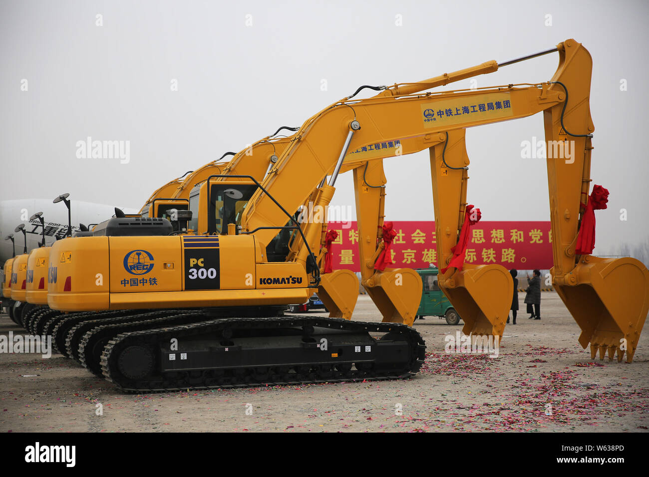 --FILE--Excavators are standby at the construction site of a rail ...