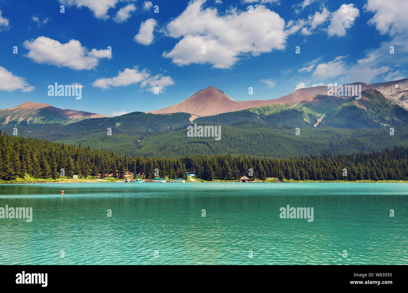 Serene scene by the mountain lake in Canada with reflection of the ...