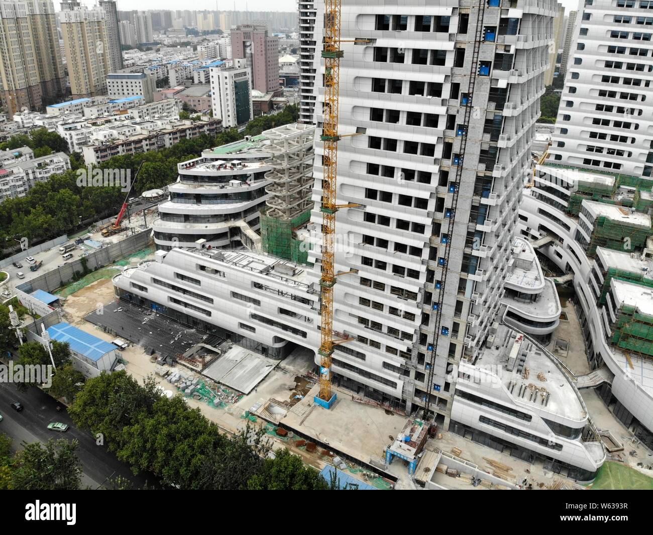 Aerial view of a building under construction featuring the shape of a ...