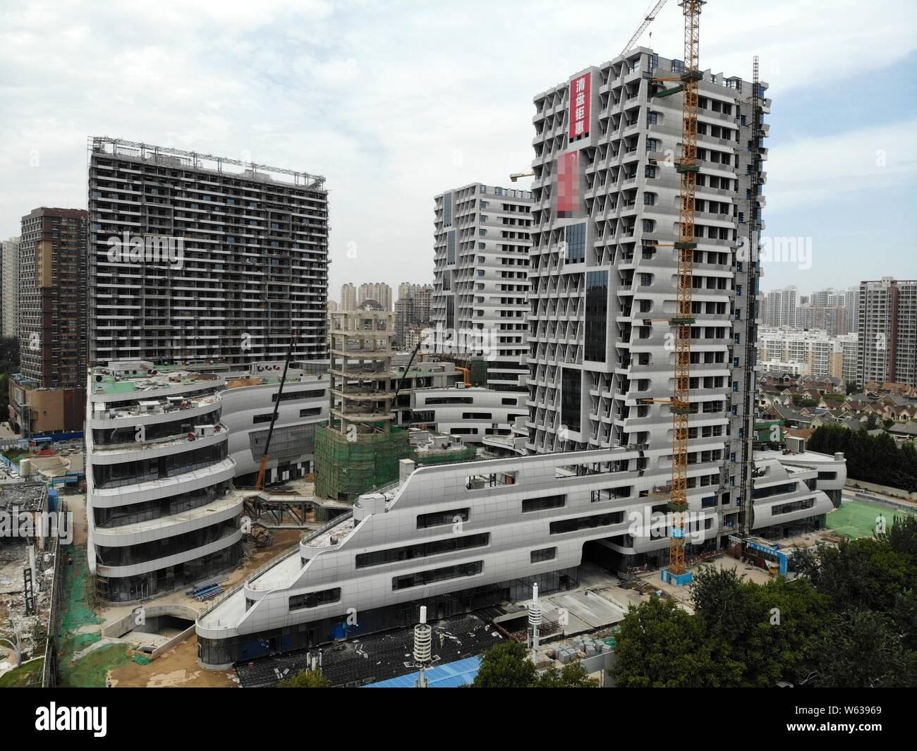 Aerial view of a building under construction featuring the shape of a ...
