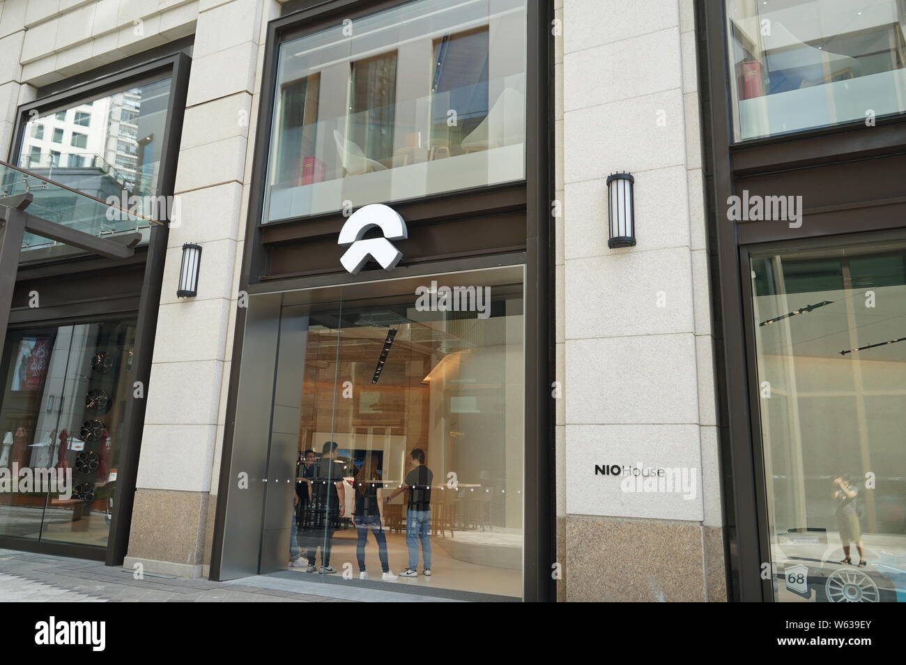 --FILE--Customers shop at a NIO House of Chinese electric car maker NIO ...