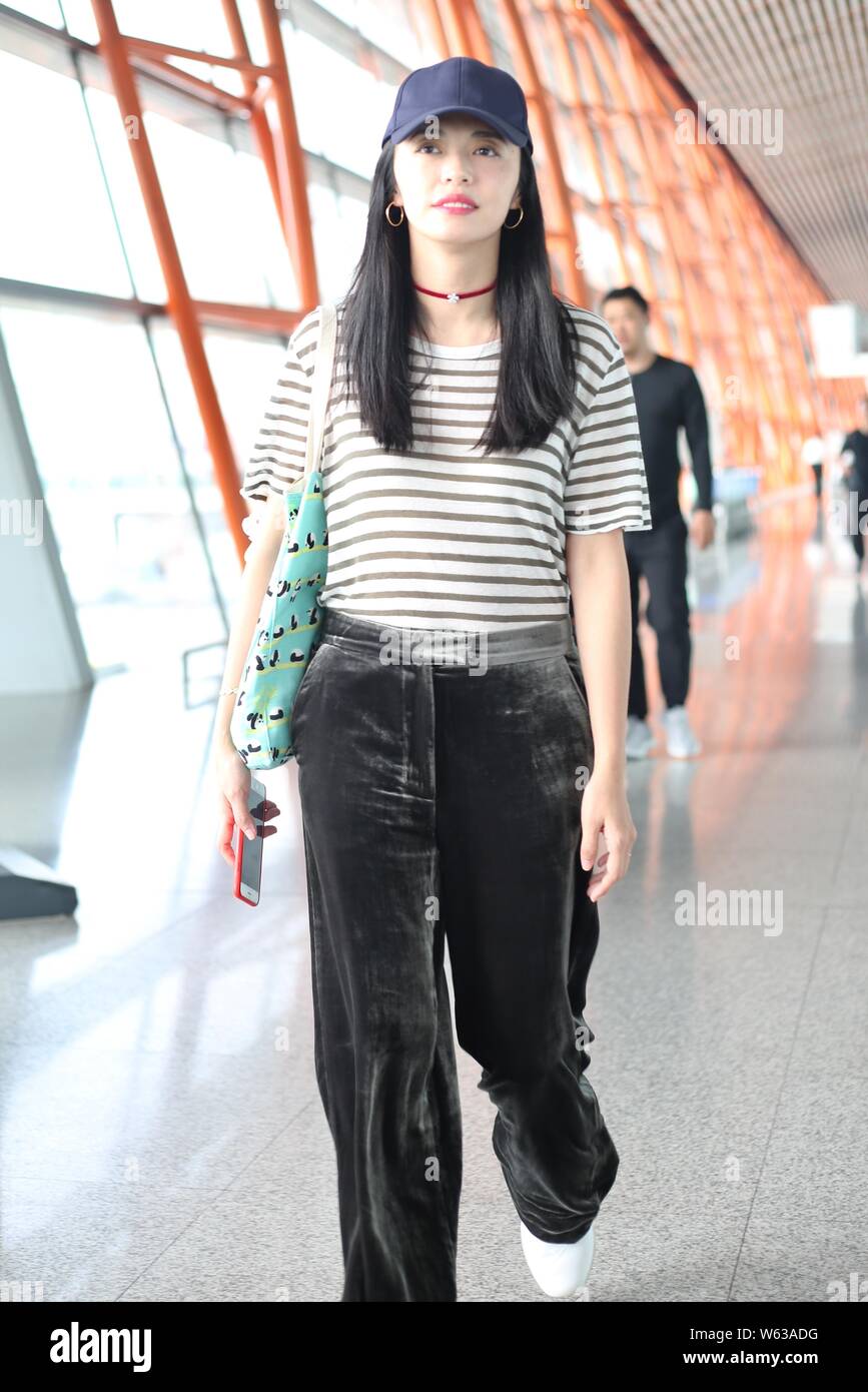 Chinese actress Yao Chen arrives at the Beijing Capital International Airport before departure ...