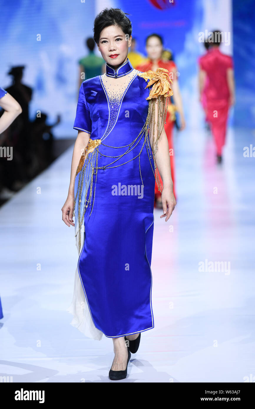 A model displays a new creation at the Jiang Xuanmin x Four famous ...