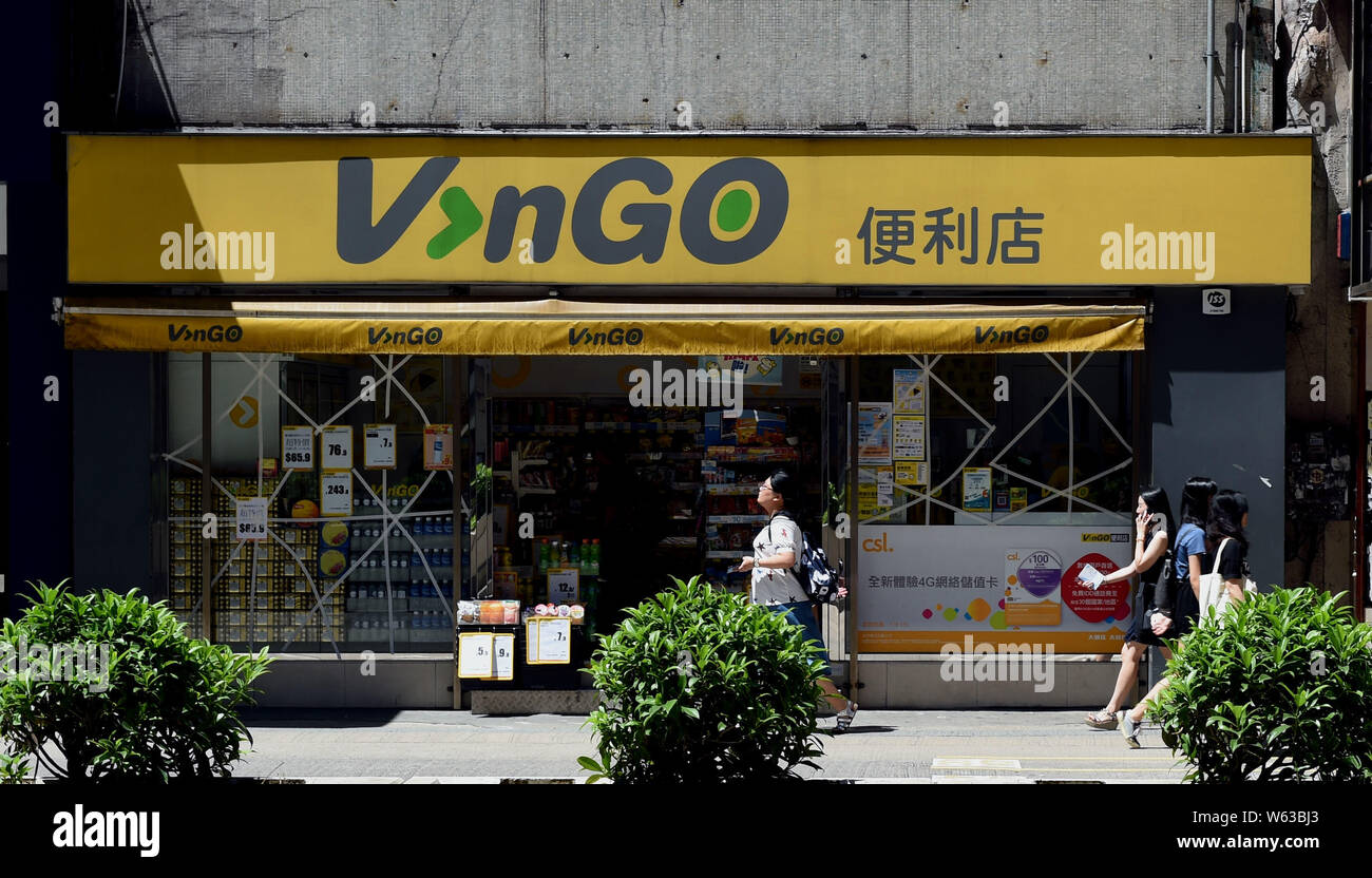Windows of a building are taped up in preparation for the Typhoon ...
