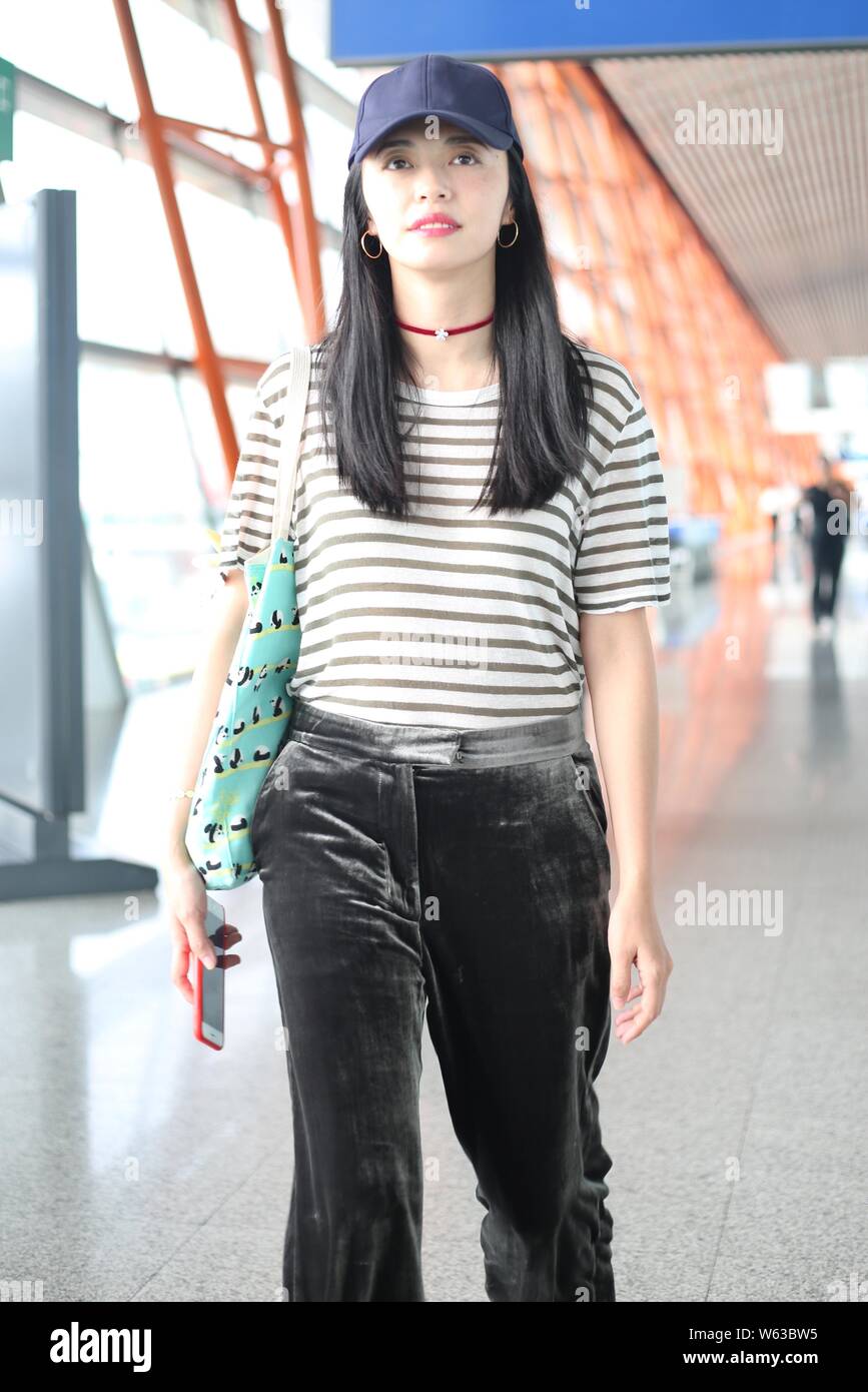 Chinese actress Yao Chen arrives at the Beijing Capital International Airport before departure ...