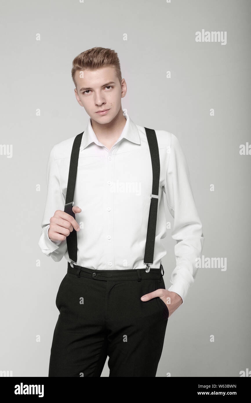 young serious man on gray background in classic style Stock Photo - Alamy
