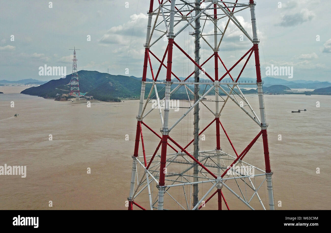 Aerial view of world's tallest transmission towers that support the 2,656-meter-long power ...