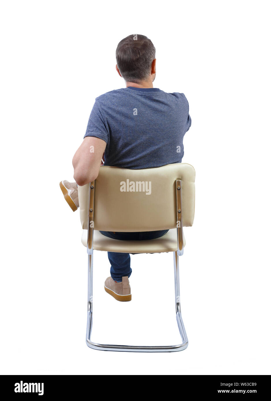 Back view of a man sitting on a chair. Rear view people collection ...
