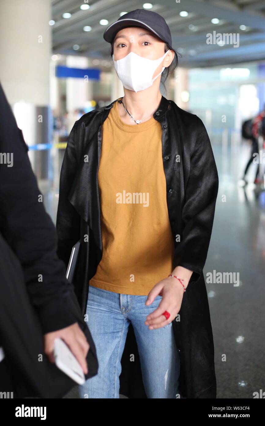 Chinese actress Zhou Xun arrives at the Beijing Capital International Airport in Beijing, China ...