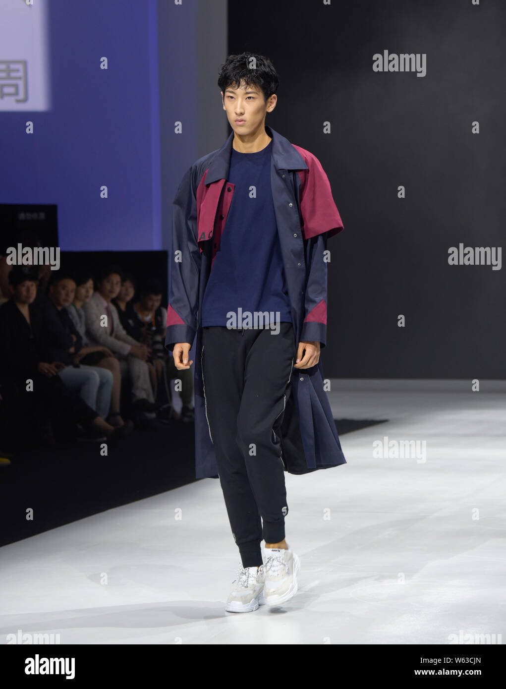 A model displays a new creation at the SHAO fashion show during the ...
