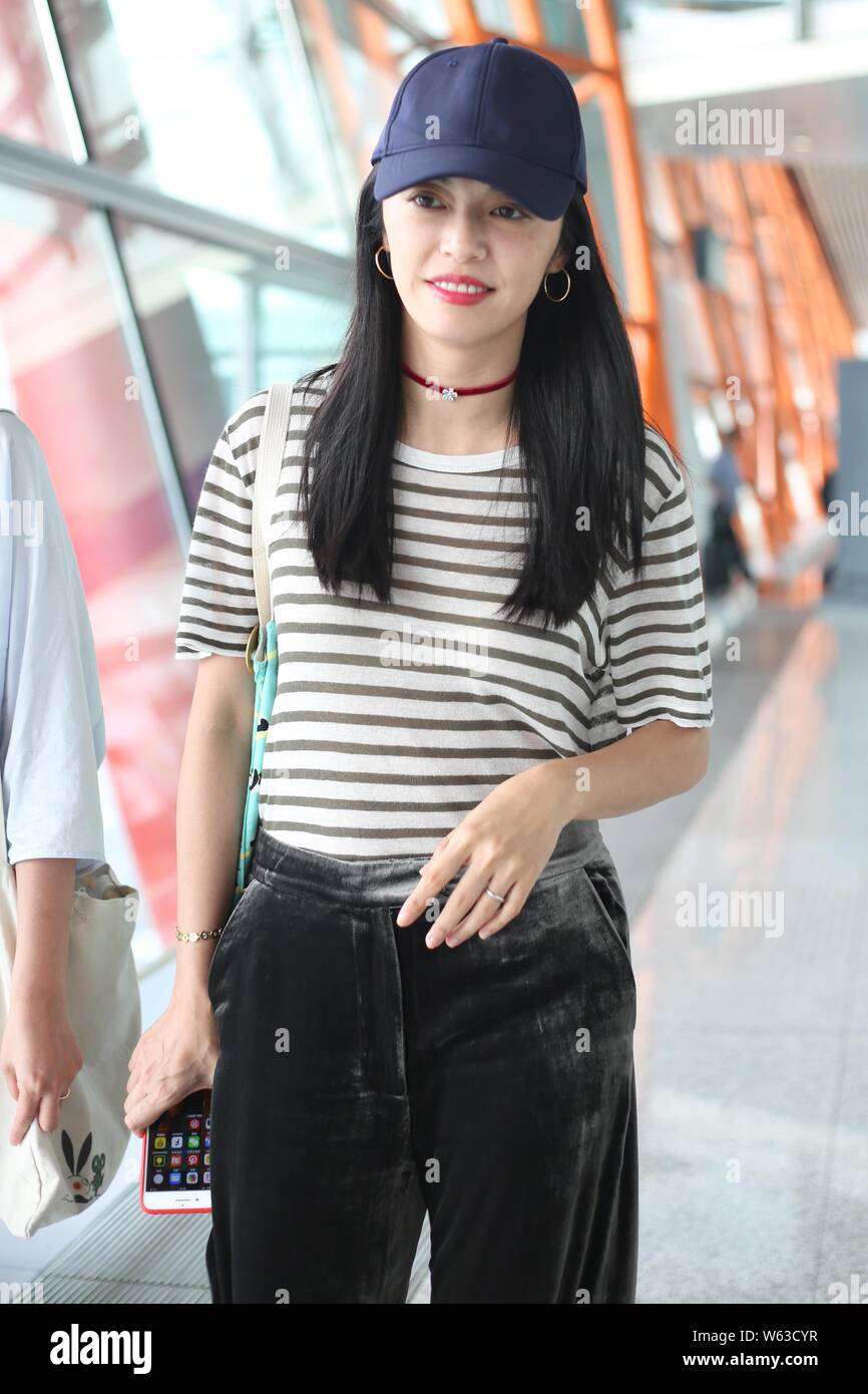 Chinese actress Yao Chen arrives at the Beijing Capital International Airport before departure ...