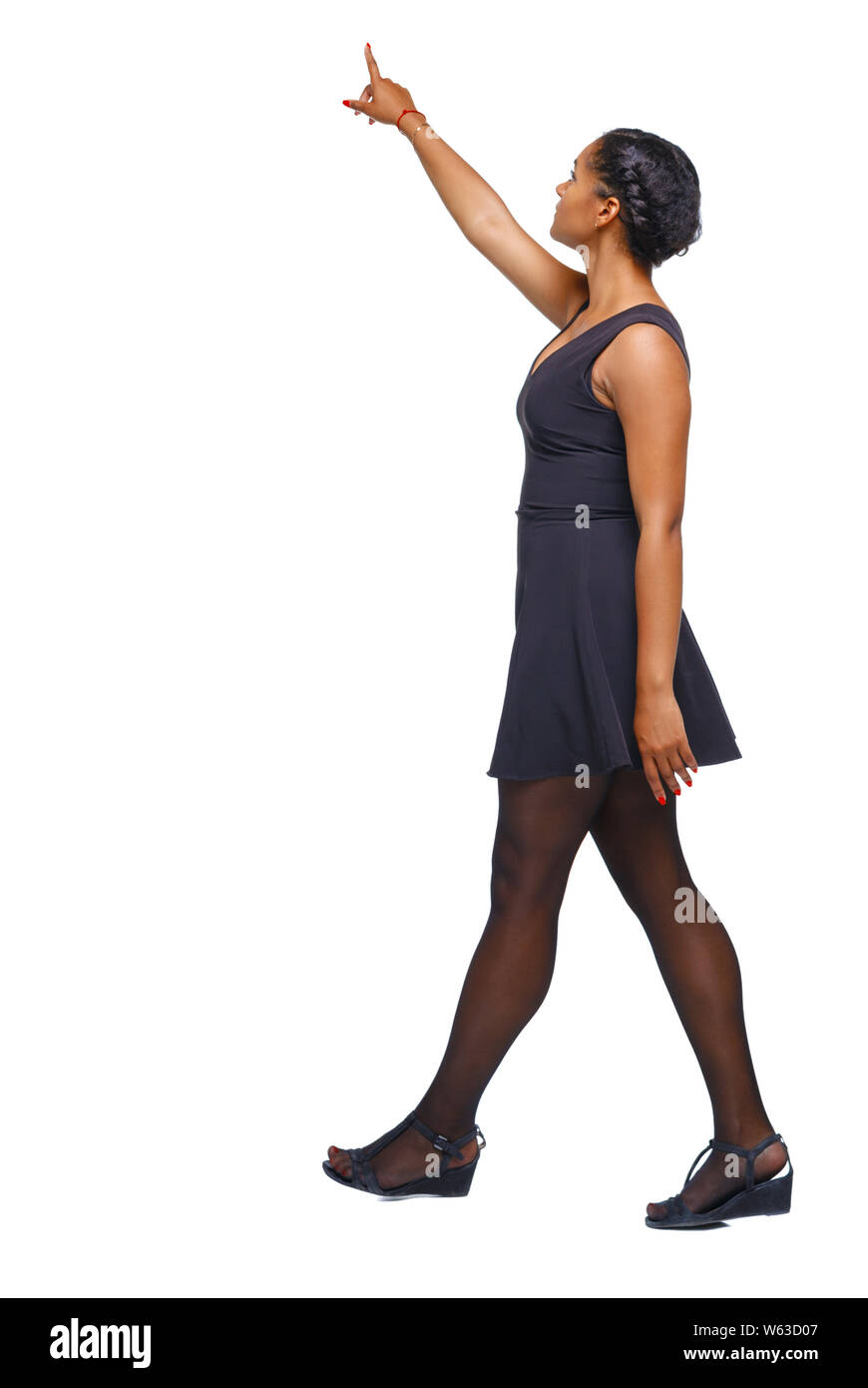 Back view of walking young black girl. going girl showing. backside ...