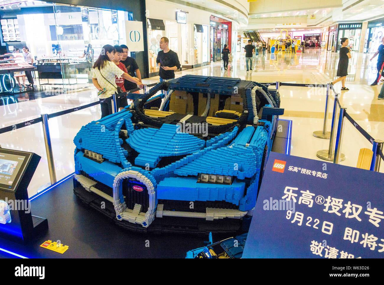 A Bugatti sports car made of 238,762 Lego bricks is on display at a ...
