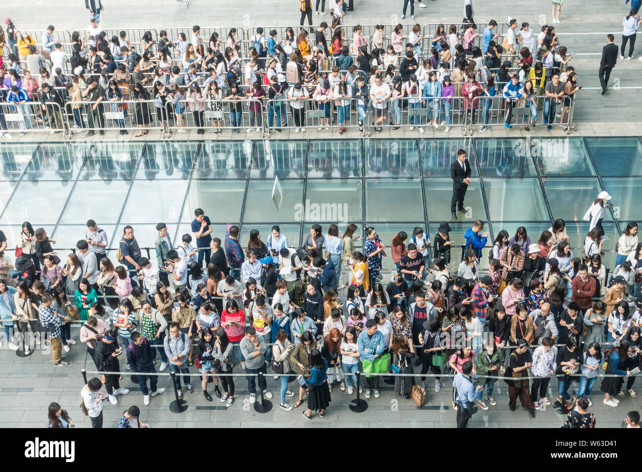 Chinese customers queue up to buy cheese tea at a branch of HEYTEA, a ...