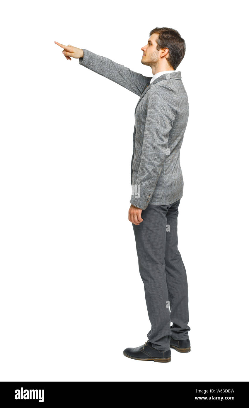 Side view of pointing business man. gesticulating young guy in suit ...