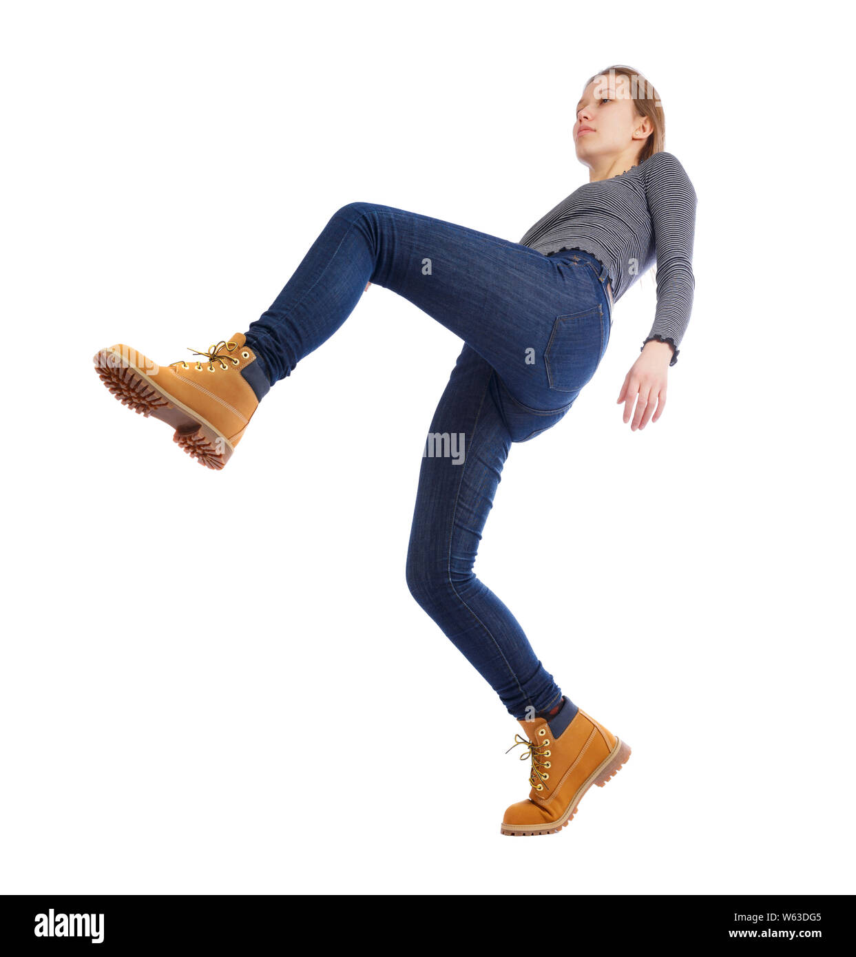 Balancing young woman. or dodge falling woman. Rear view people ...