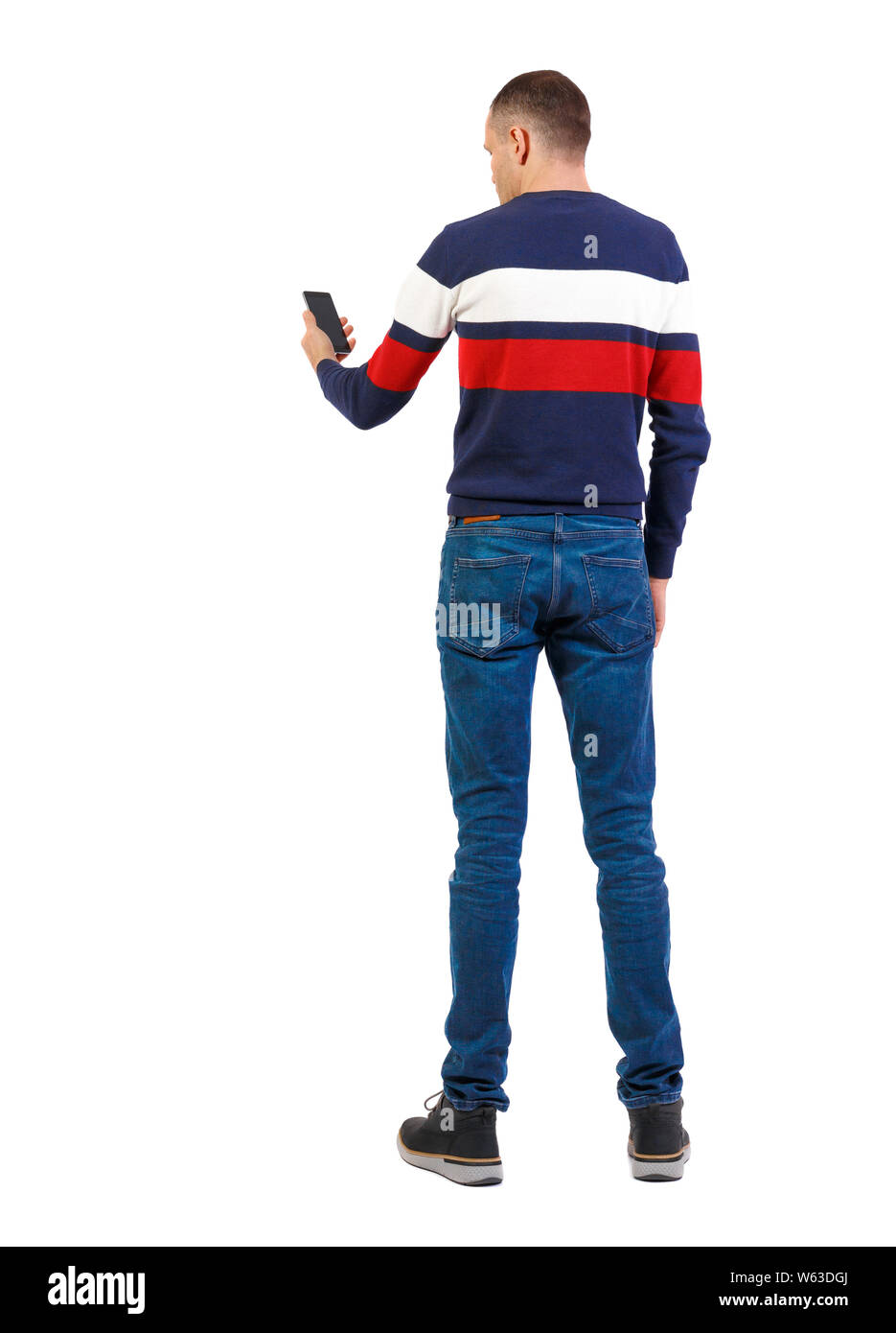 Back view of man who is looking into the smartphone. rear view people ...