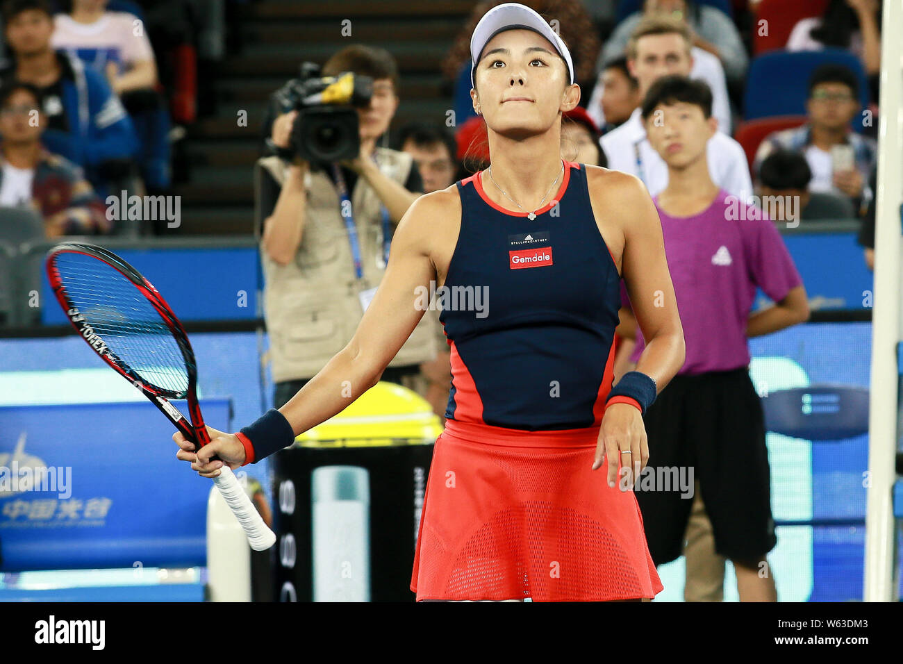 Wang Qiang of China reacts as she competes against Daria Gavrilova of ...