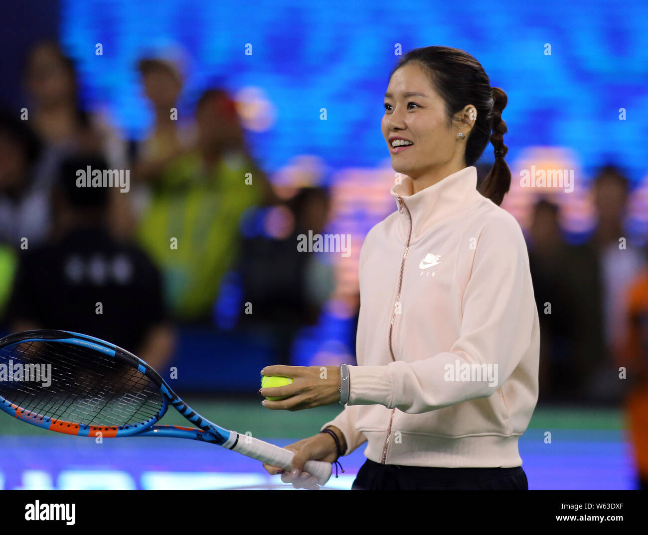 Retired Chinese tennis star Li Na is pictured at a first round match ...