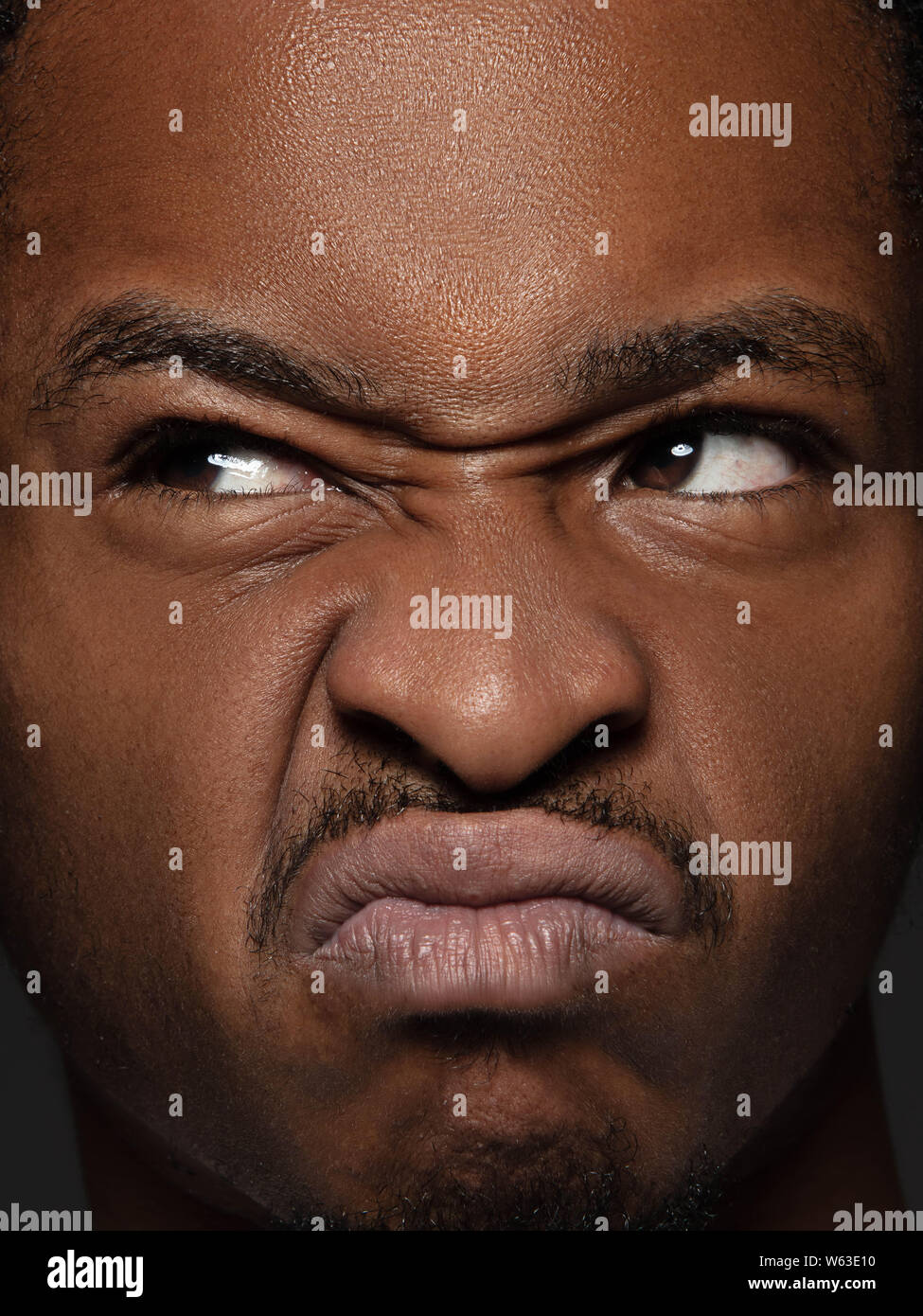 Close up portrait of young and emotional african-american man. Highly ...