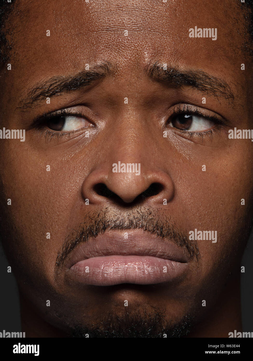 Close up portrait of young and emotional african-american man. Highly ...