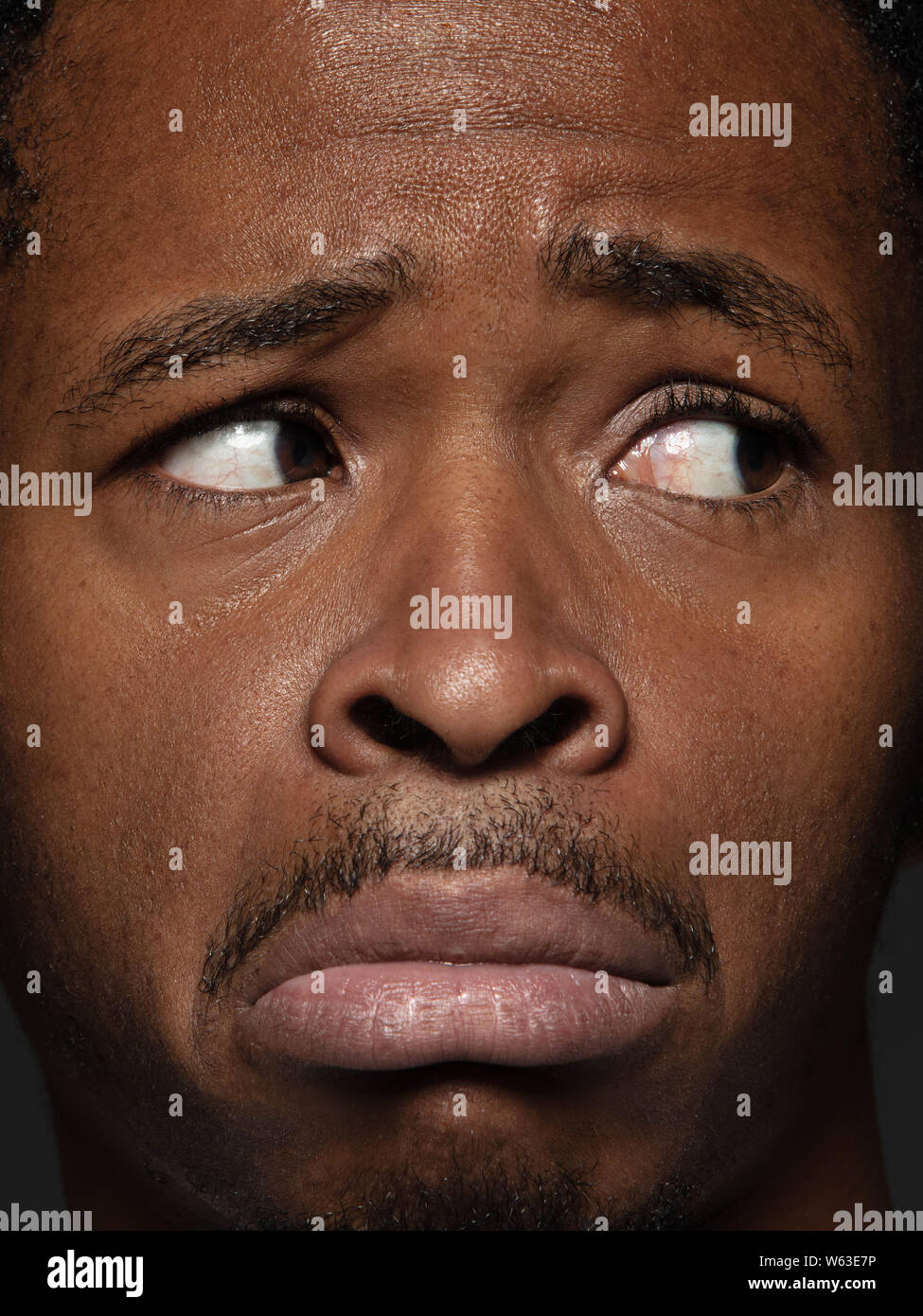 Close up portrait of young and emotional african-american man. Highly ...