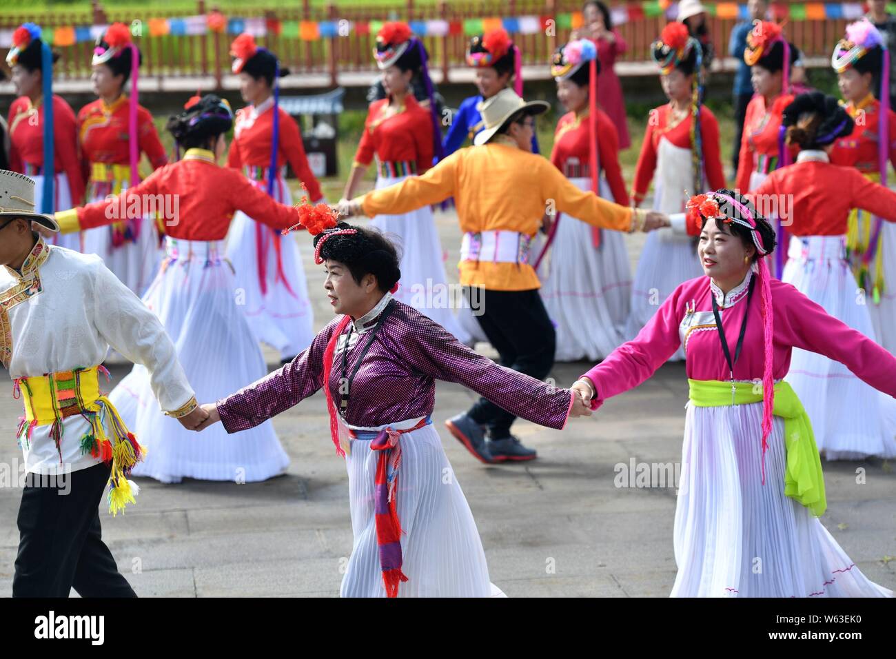 66 couples dressed in Mosuo people's traditional clothing take part in ...
