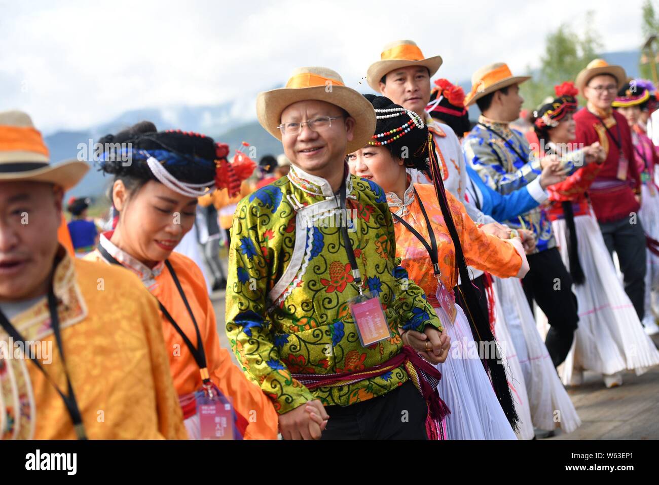 66 couples dressed in Mosuo people's traditional clothing take part in ...