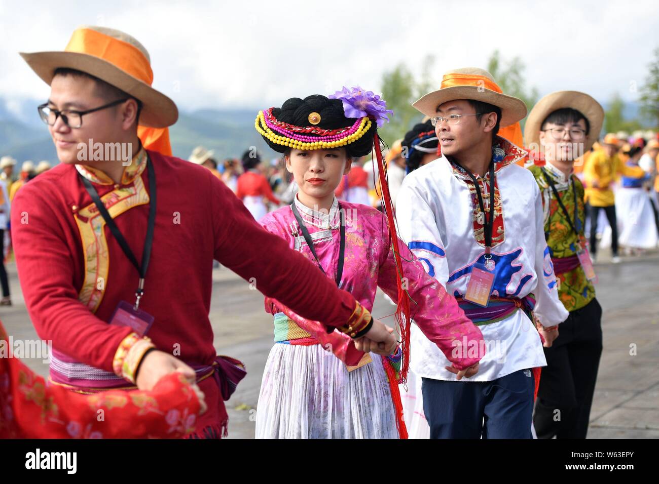 66 couples dressed in Mosuo people's traditional clothing take part in ...