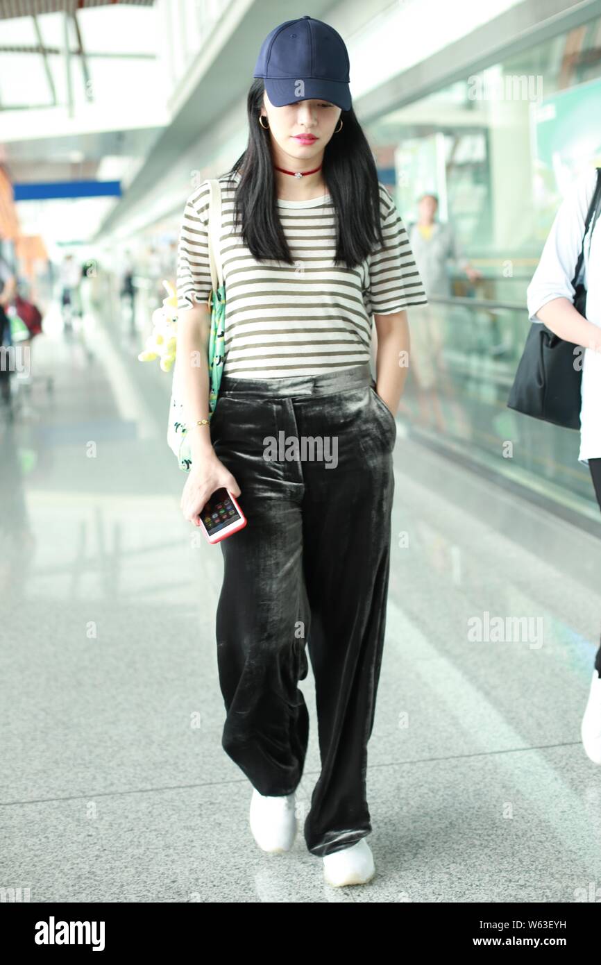 Chinese actress Yao Chen arrives at the Beijing Capital International Airport before departure ...