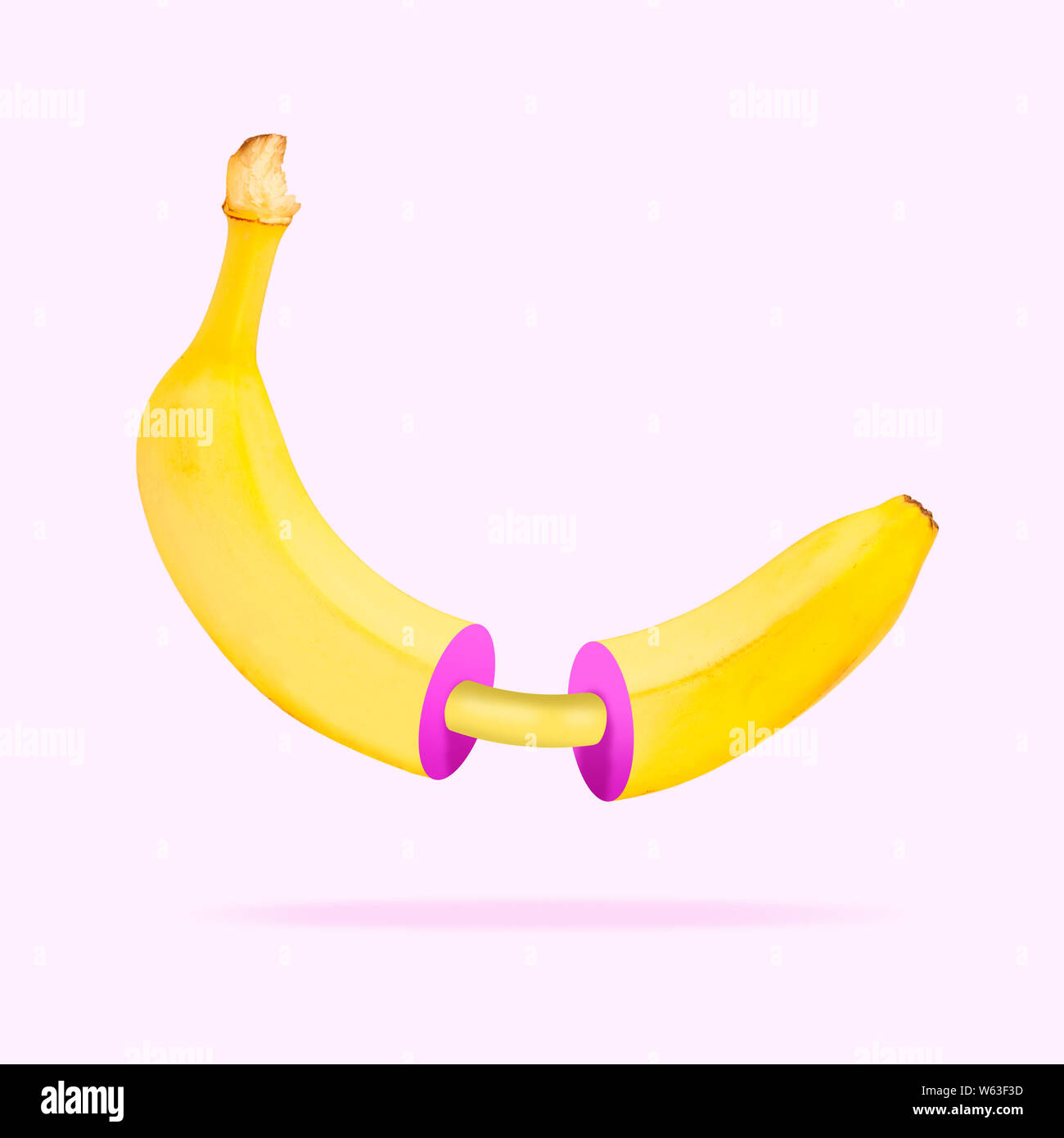 The hidden world. An alternative look of banana on pink background ...