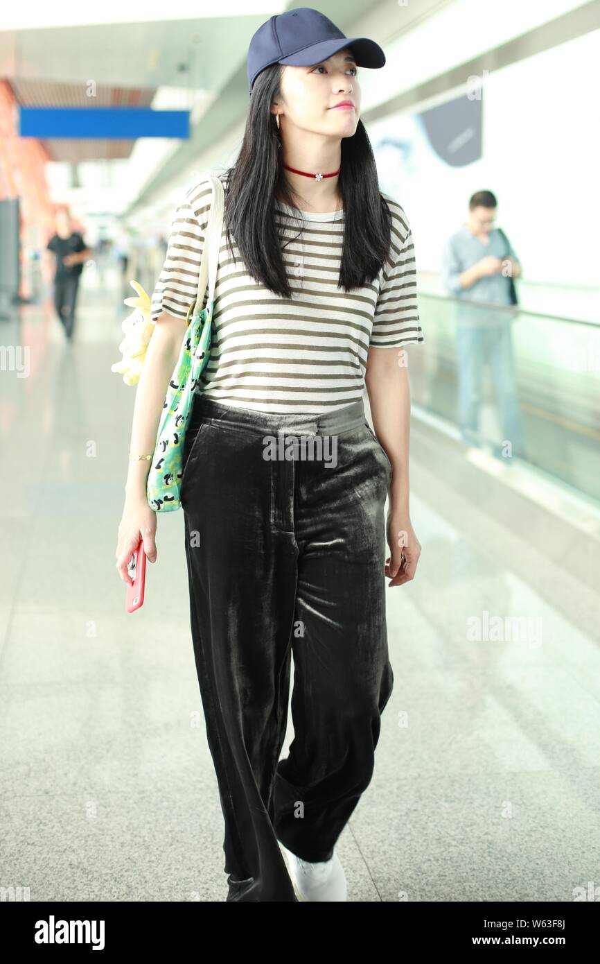 Chinese actress Yao Chen arrives at the Beijing Capital International Airport before departure ...
