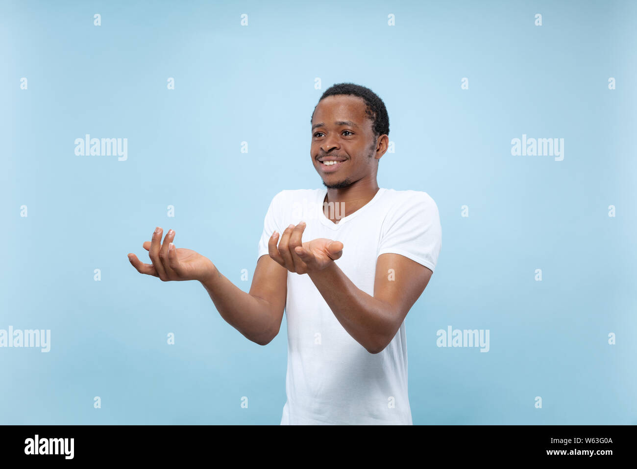 Half-length close up portrait of young african-american male model in ...