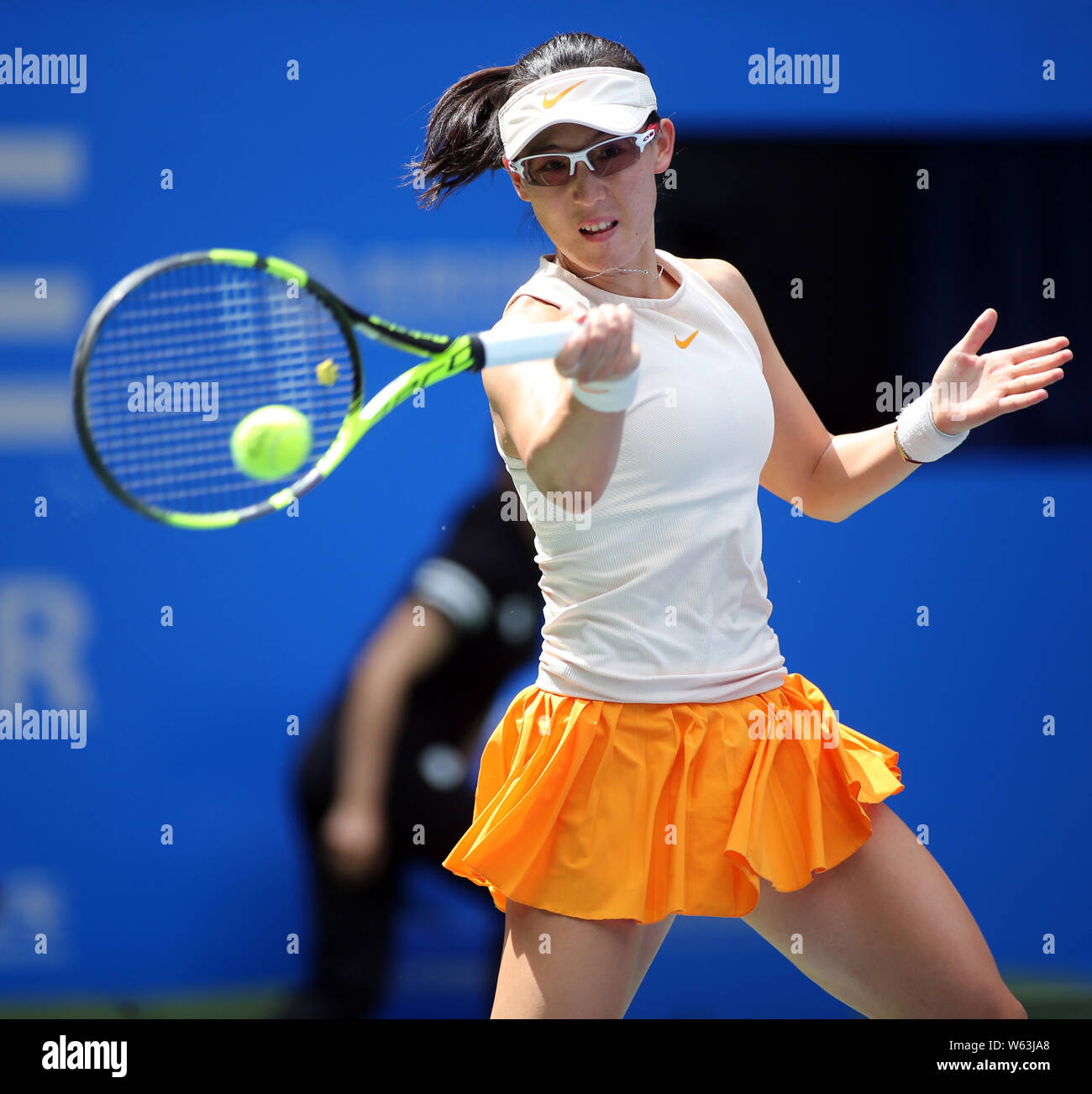 Zheng Saisai of China returns a shot to Danielle Collins of the United ...