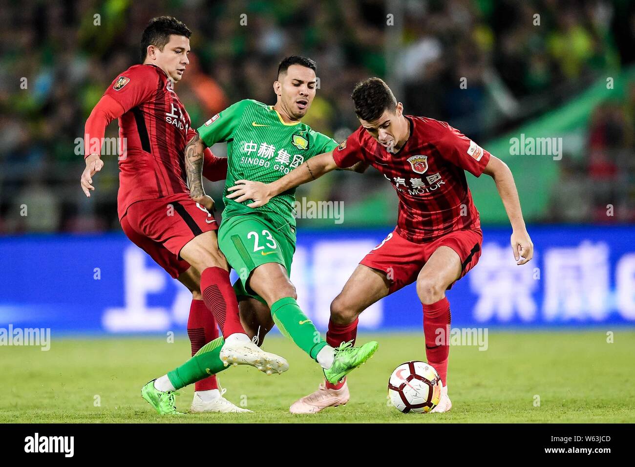 Spanish football player Jonathan Viera of Beijing Sinobo Guoan, center ...
