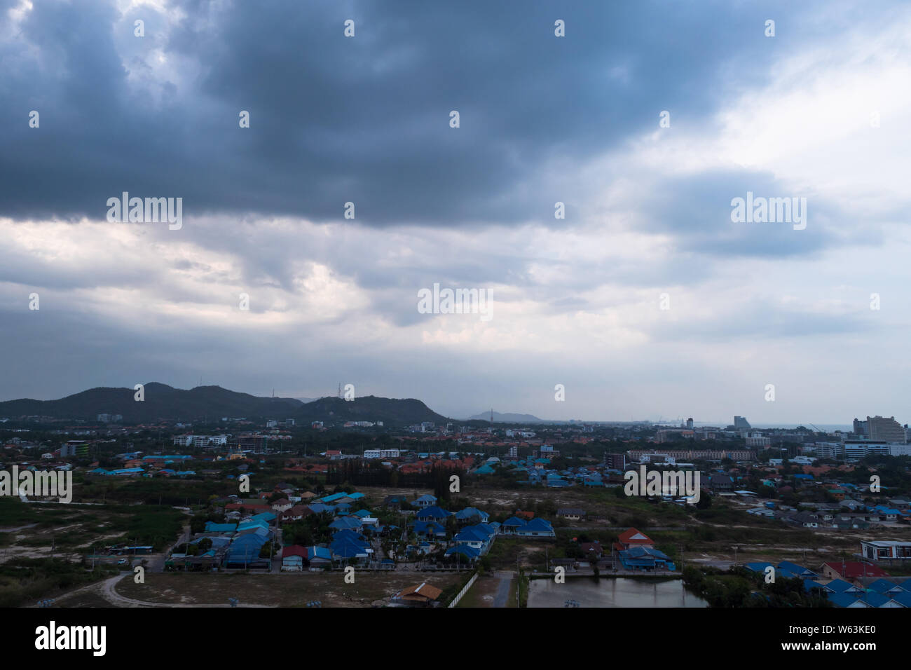 Aerial view scenic landscape of the city with storm cloud rain will ...