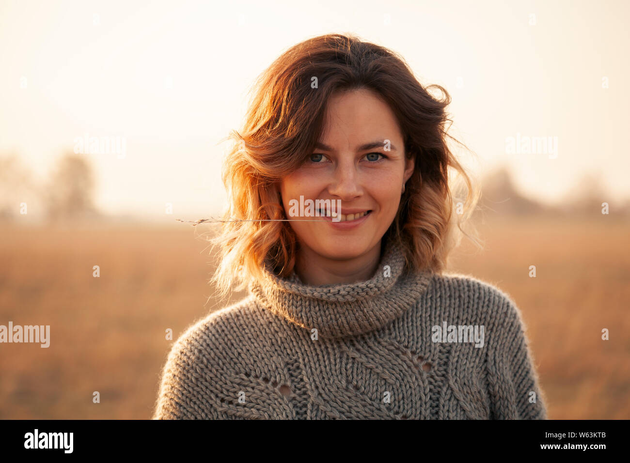 Fashion lifestyle portrait of young trendy woman dressed in brown knit ...