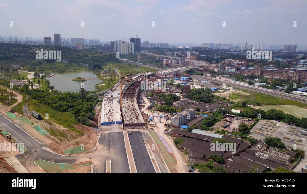 An 18,000-tonne box girder bridge is rotating 120 degrees over a ...