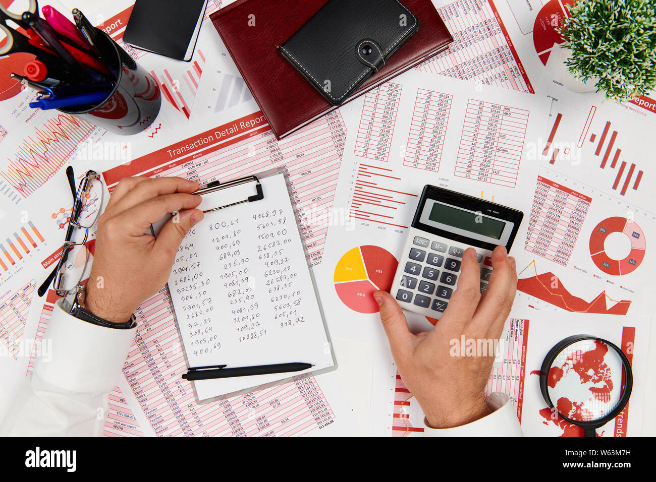 Business reports, data tables and charts - directly above view of ...