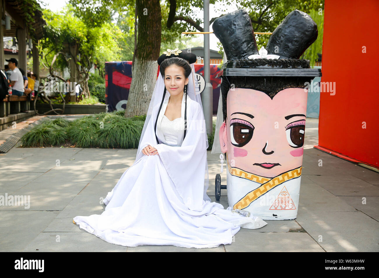 A college student dressed in the shape of "White Lady" or "White Maiden ...