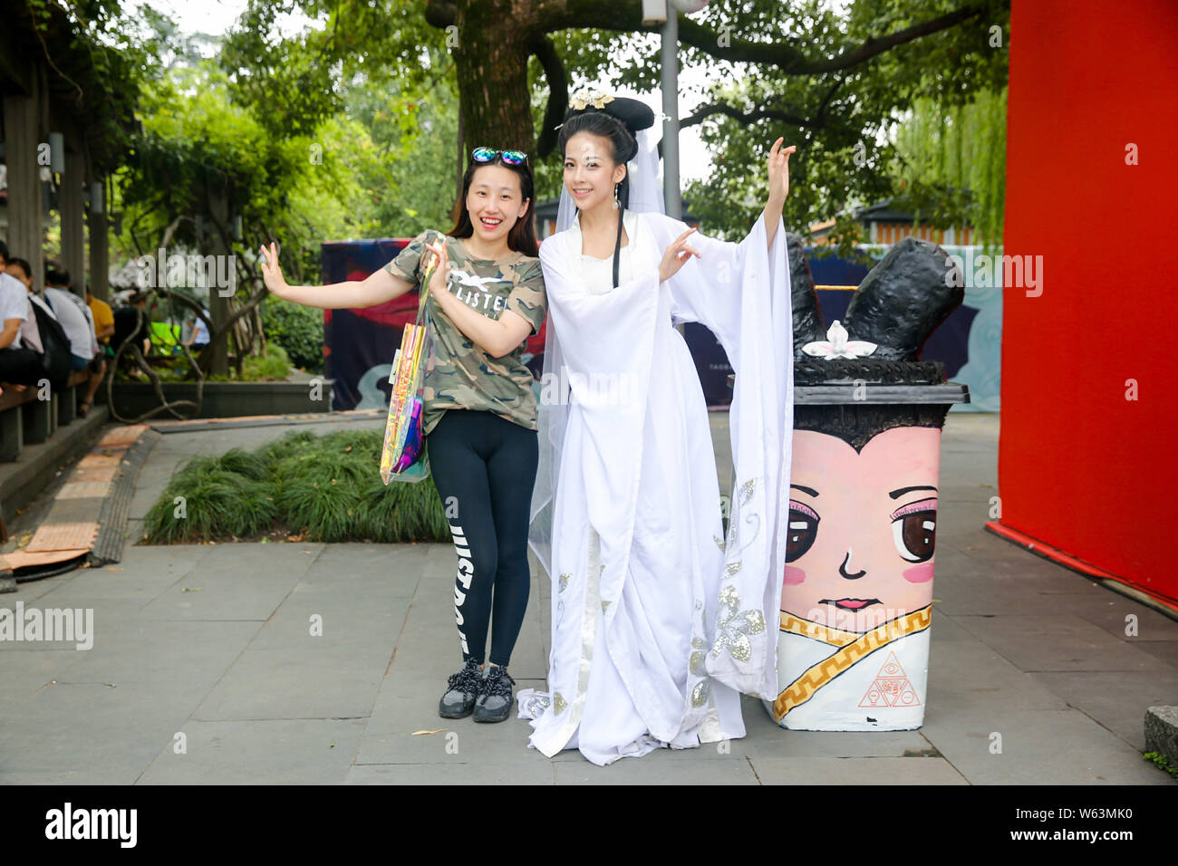 A college student, right, dressed in the shape of "White Lady" or ...