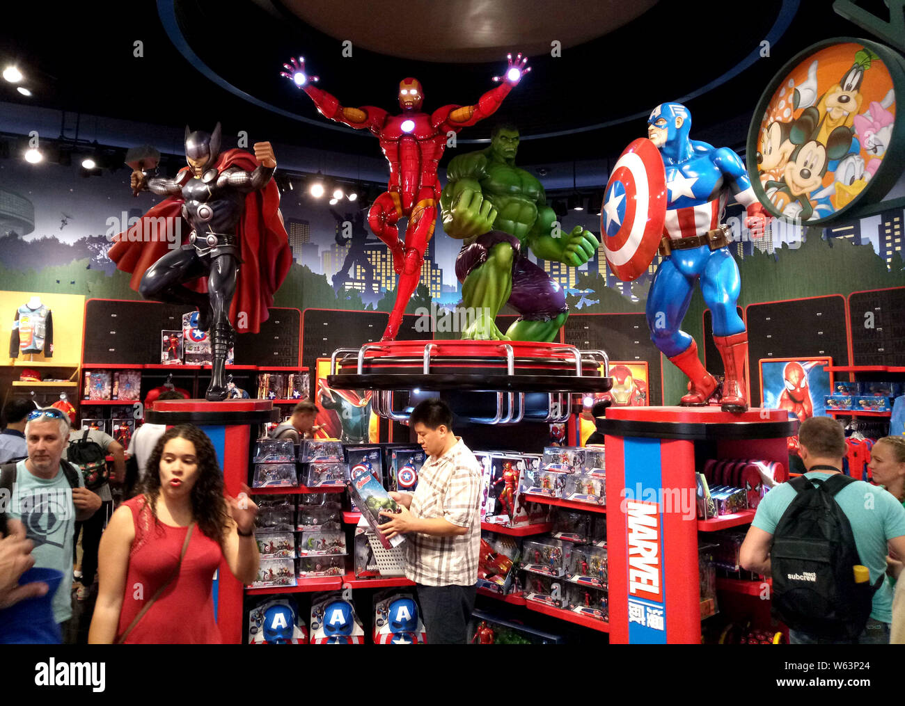 --FILE--Customers shop for toys, souvenirs and other Disney-licensed ...