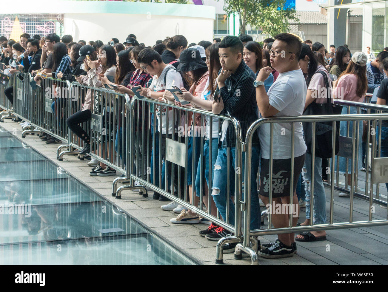 Chinese customers queue up to buy cheese tea at a branch of HEYTEA, a ...