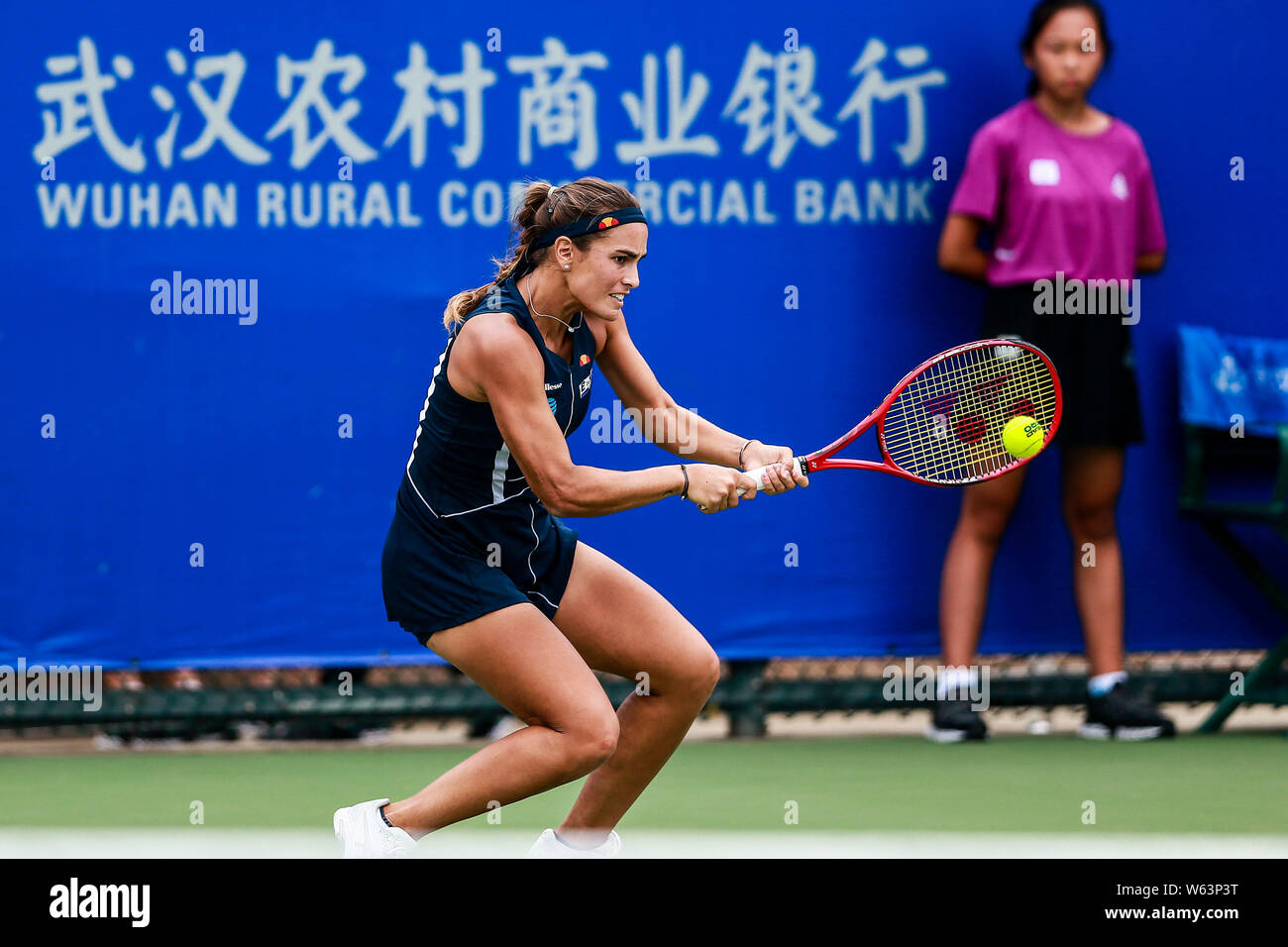Monica Puig of Puerto Rico returns a shot to Claire Liu of United ...