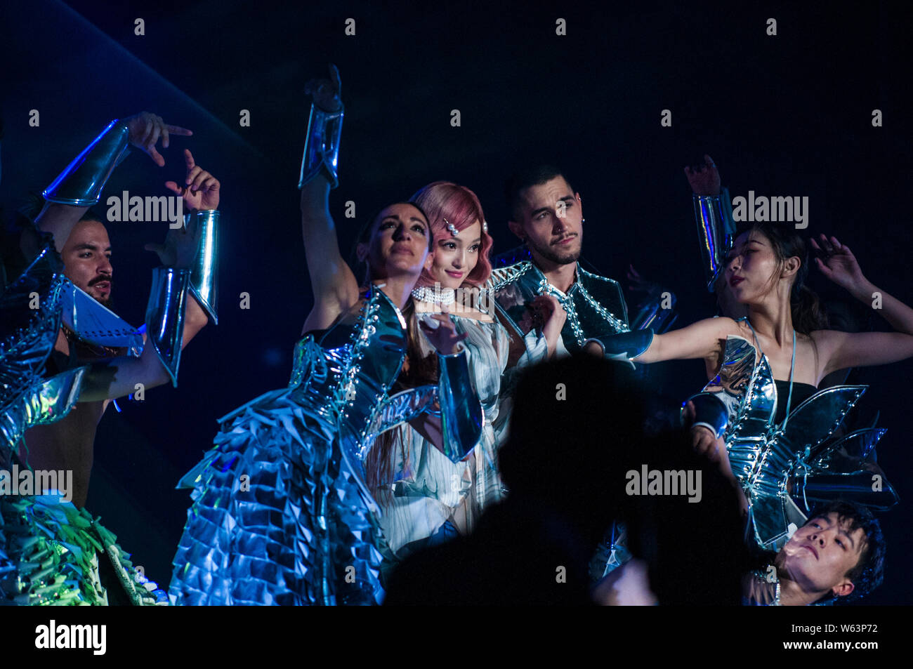 Taiwanese singer and actress Angela Chang, center, performs during her ...