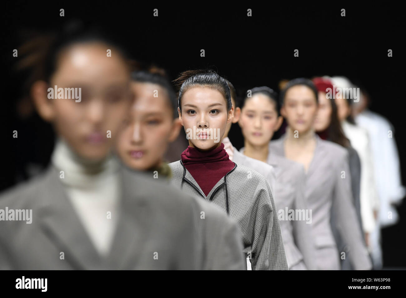 Models display new creations at the JD x Tracy Chu fashion show during ...